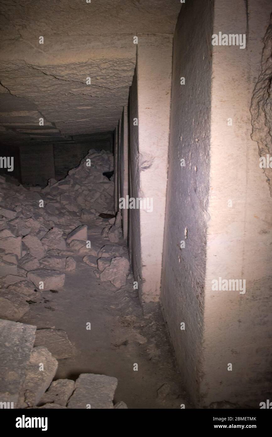 Old underground passage, dungeon, catacombs lined with stones ...