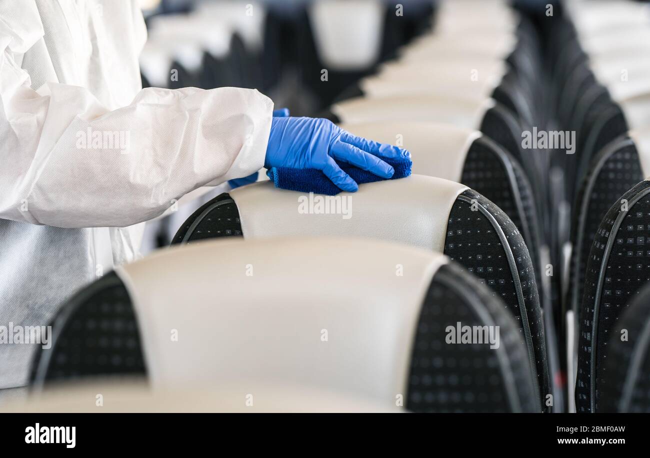 Specialist spraying disinfectant sanitize bus hi-res stock photography ...