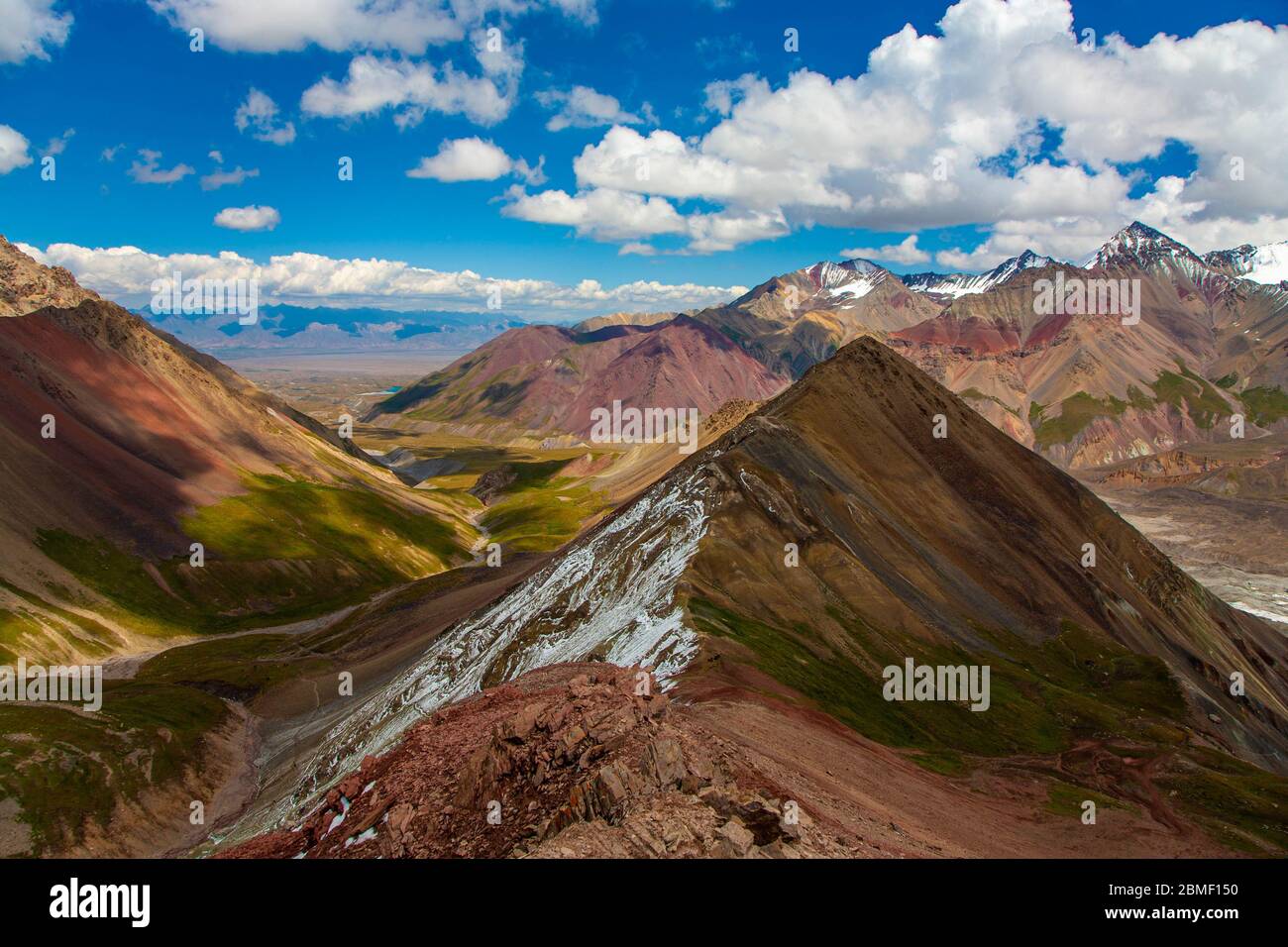 Scenic landscape of green mountain with red sand. Mounainious terrain ...