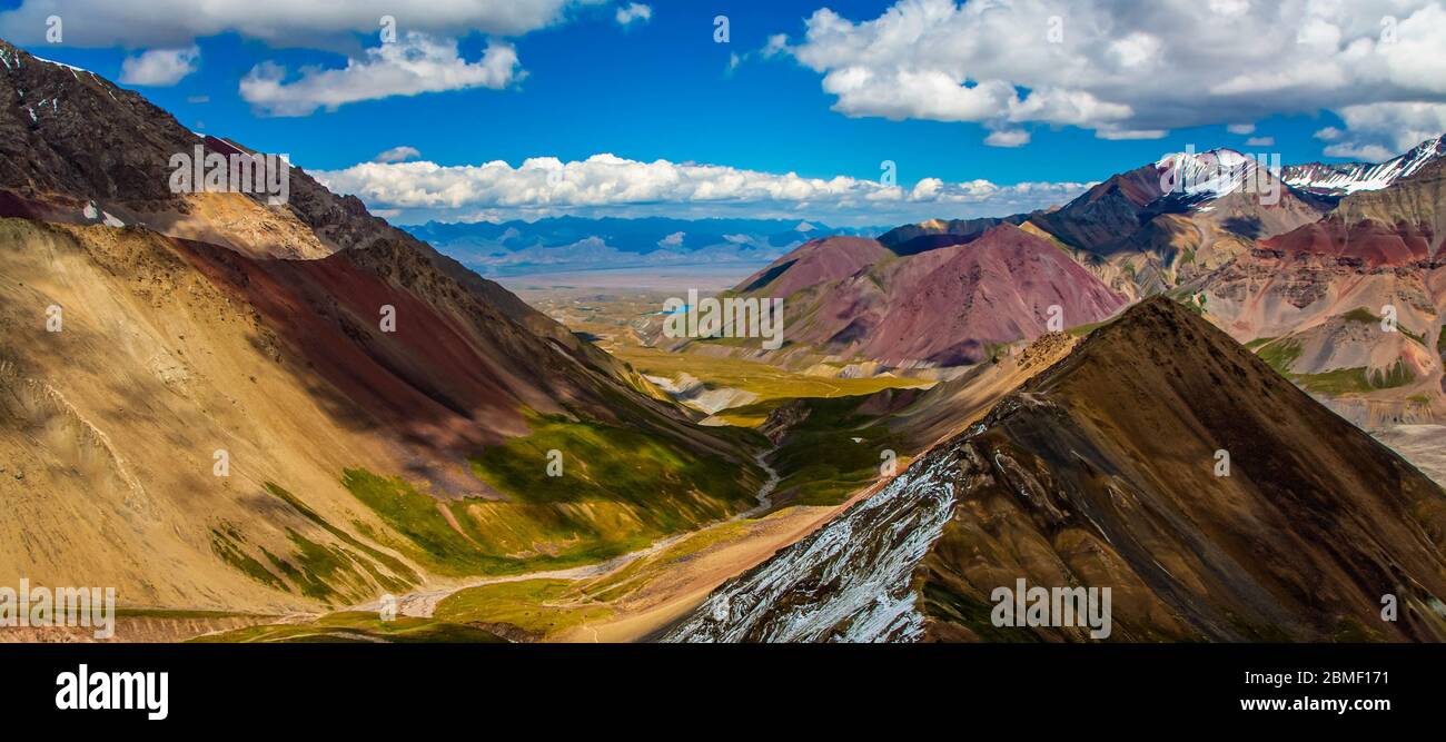 Scenic landscape of green mountain with red sand. Mounainious terrain ...
