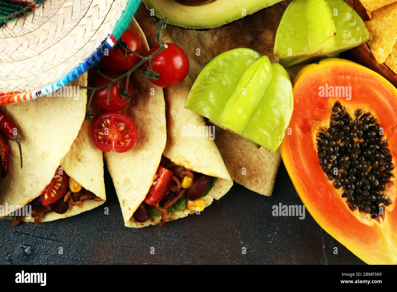 Mexican food mix in colorful colors. sombrero and mexican food with ...