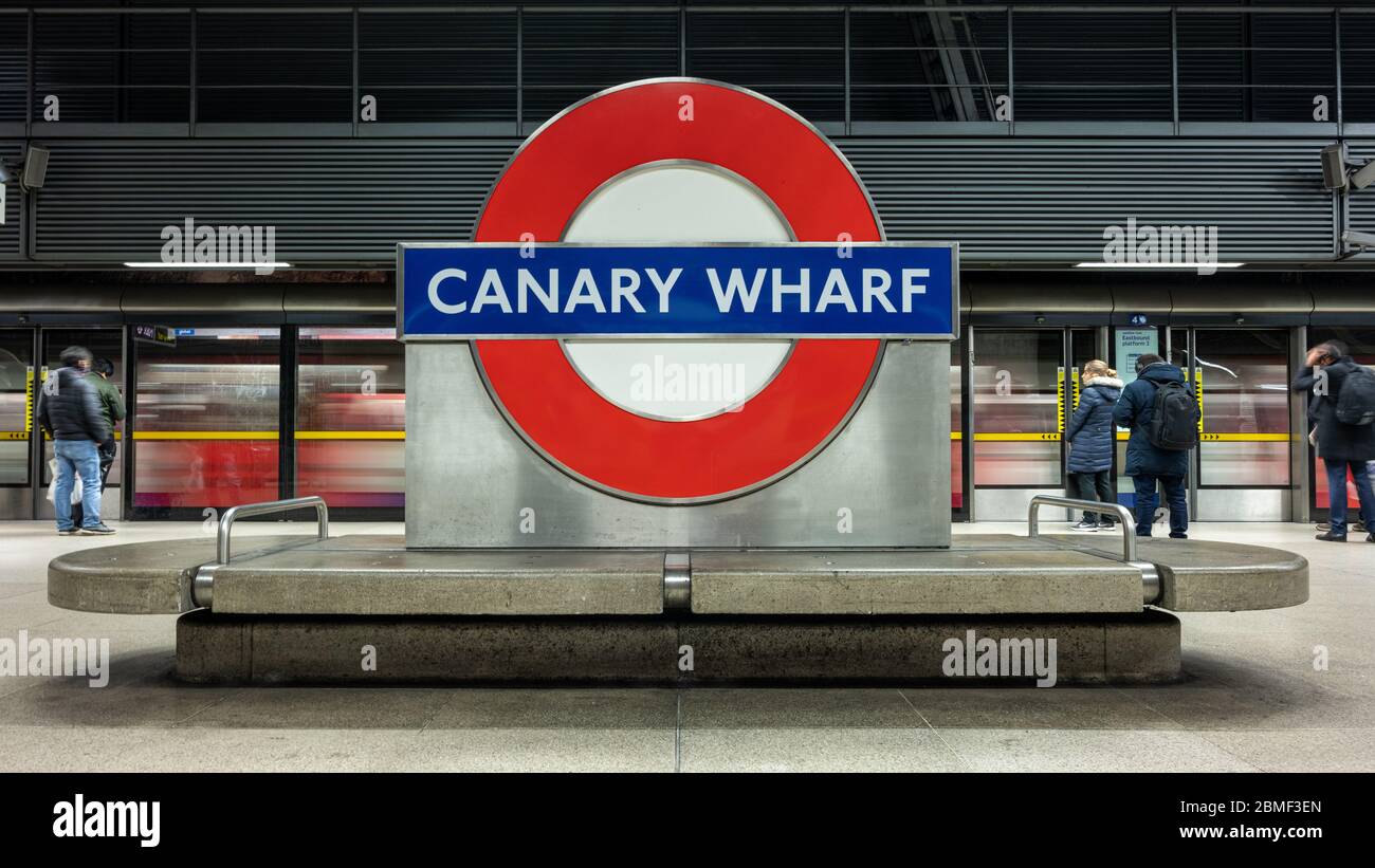 A train at the platform at canary wharf tube station hi-res stock ...