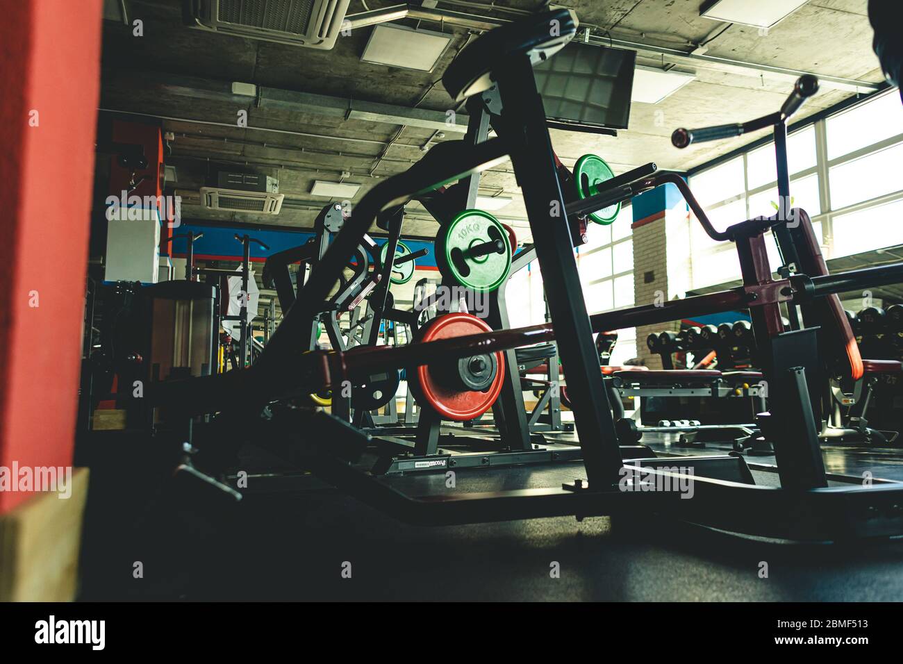 Running simulators in the gym interior opposite the window. Empty ...