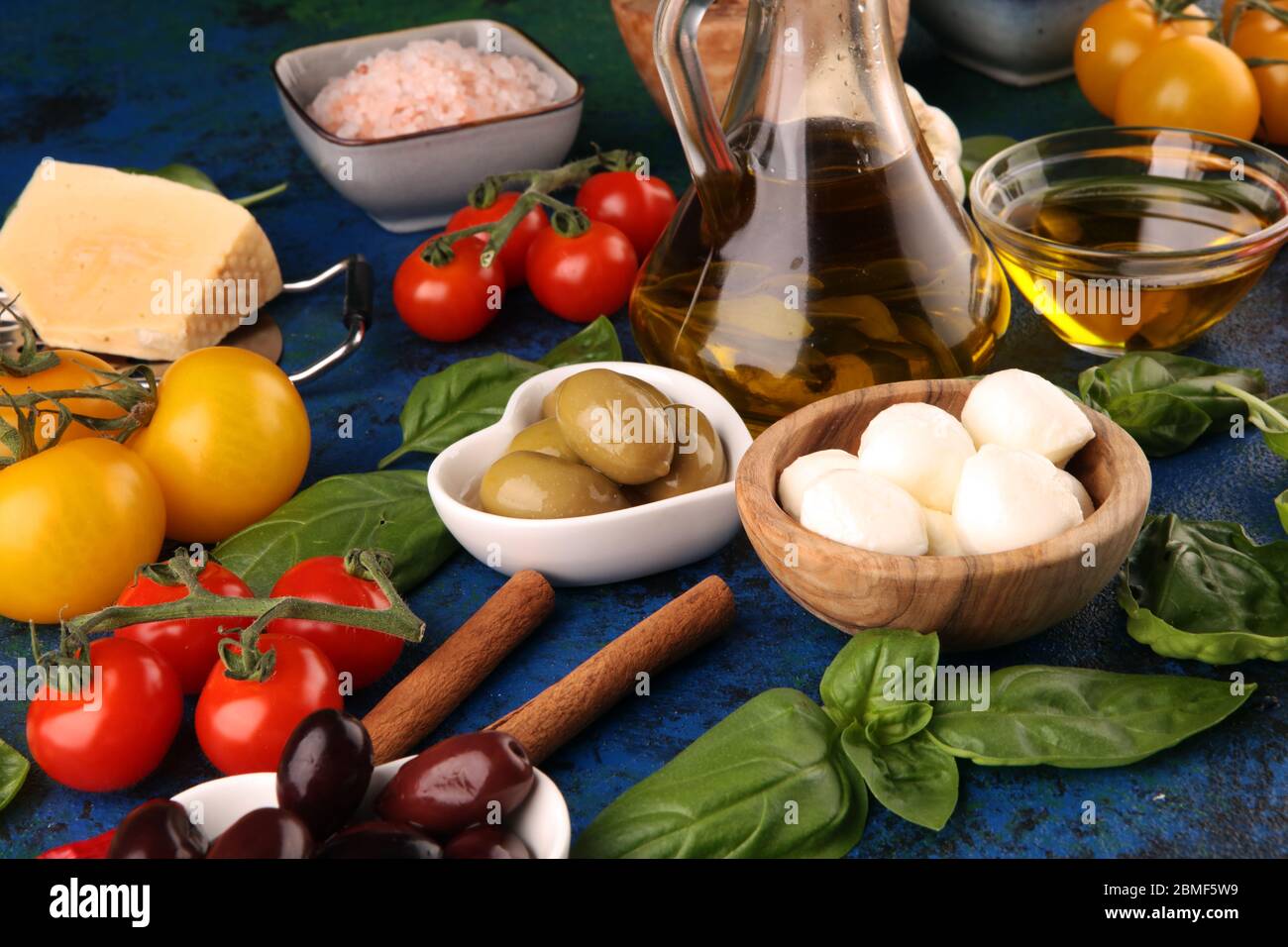 Italian food background with herbs and spices, vine tomatoes, basil ...