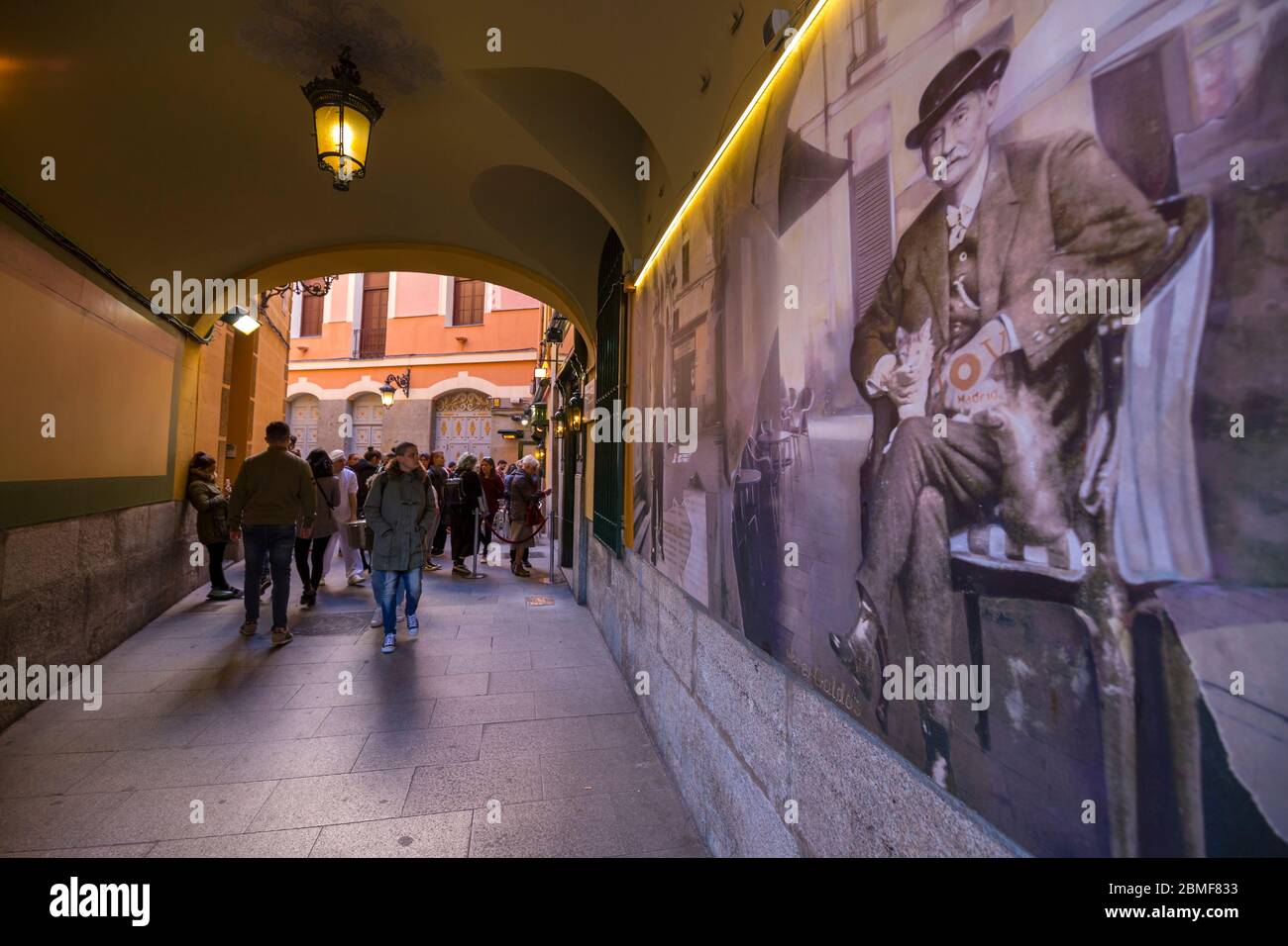 View of mural painting in ally way near San Gines Chocolateria, Madrid ...