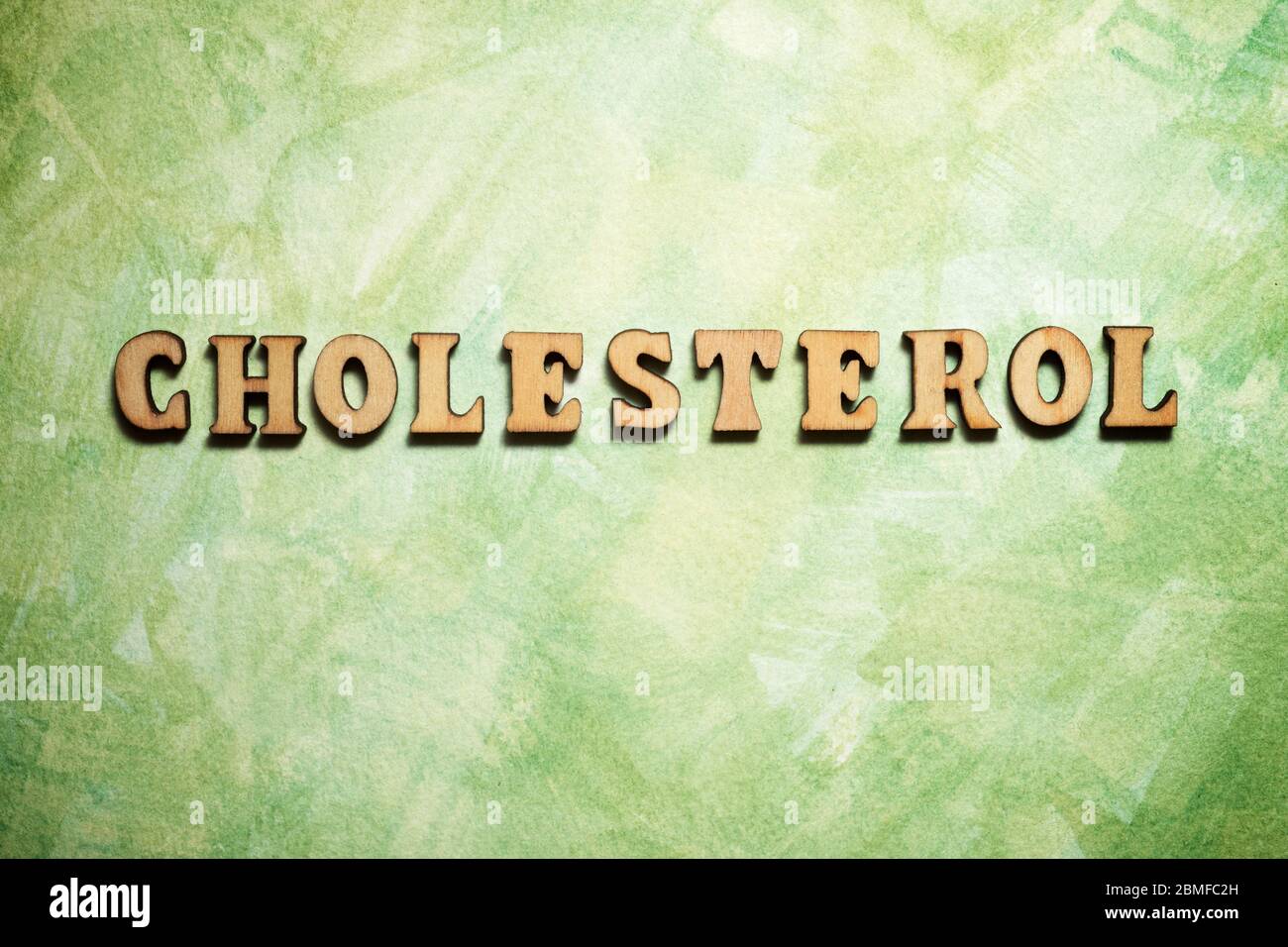 Cholesterol word on a green paper Stock Photo - Alamy
