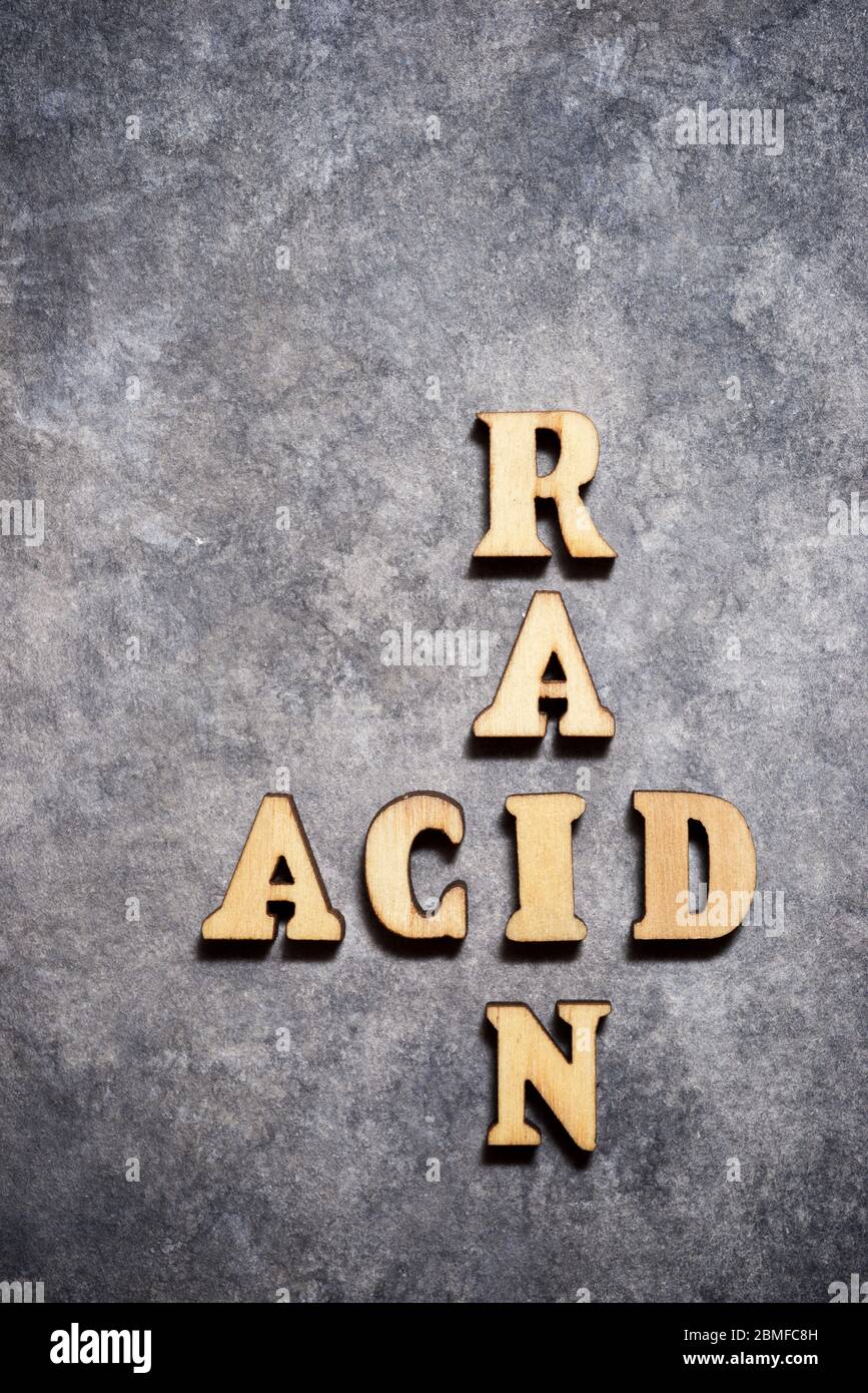 Acid rain text on a gray paper Stock Photo - Alamy