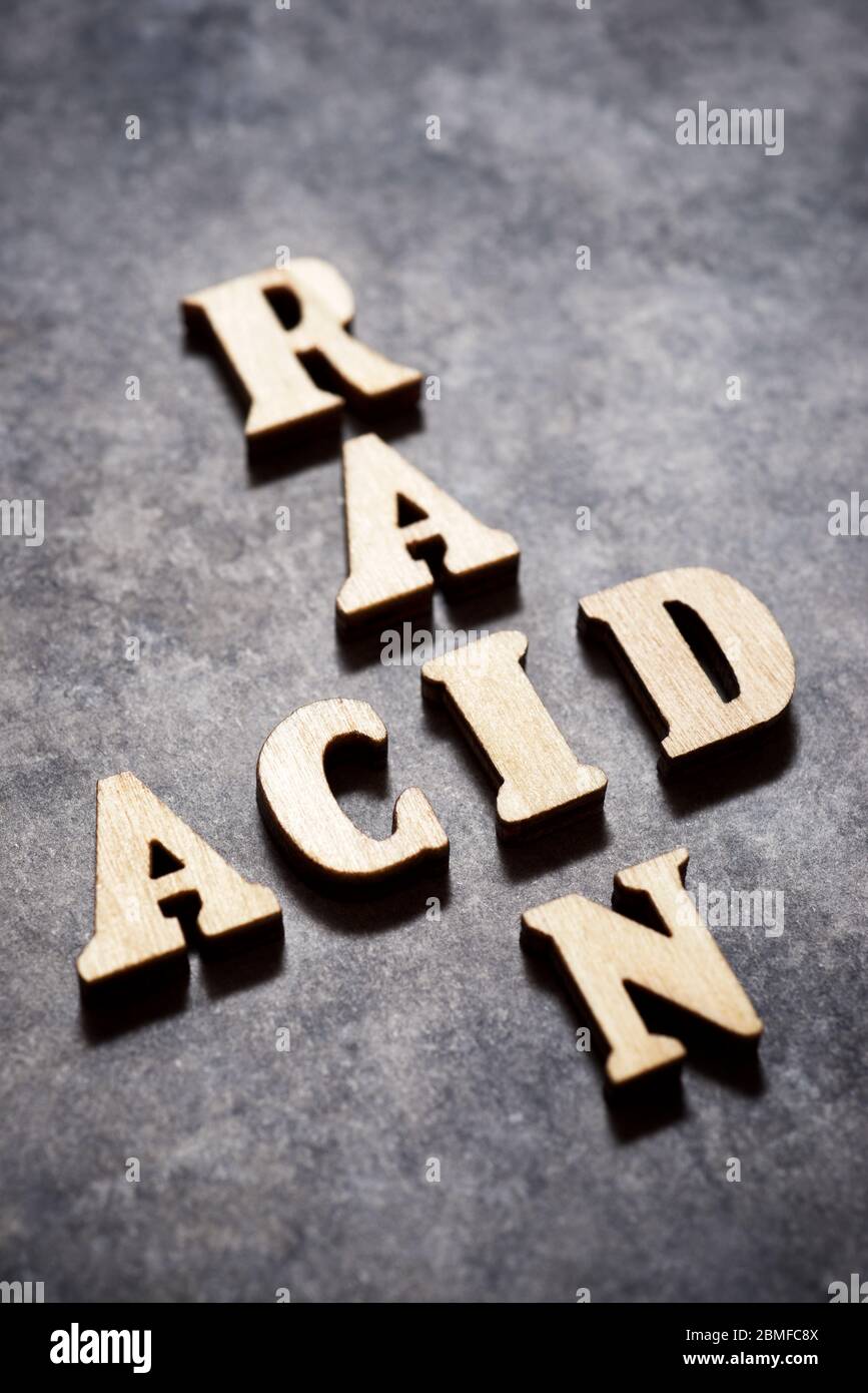 Acid rain text on a gray paper Stock Photo - Alamy