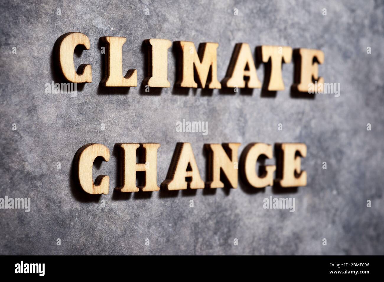 Climate change text on a gray paper Stock Photo - Alamy