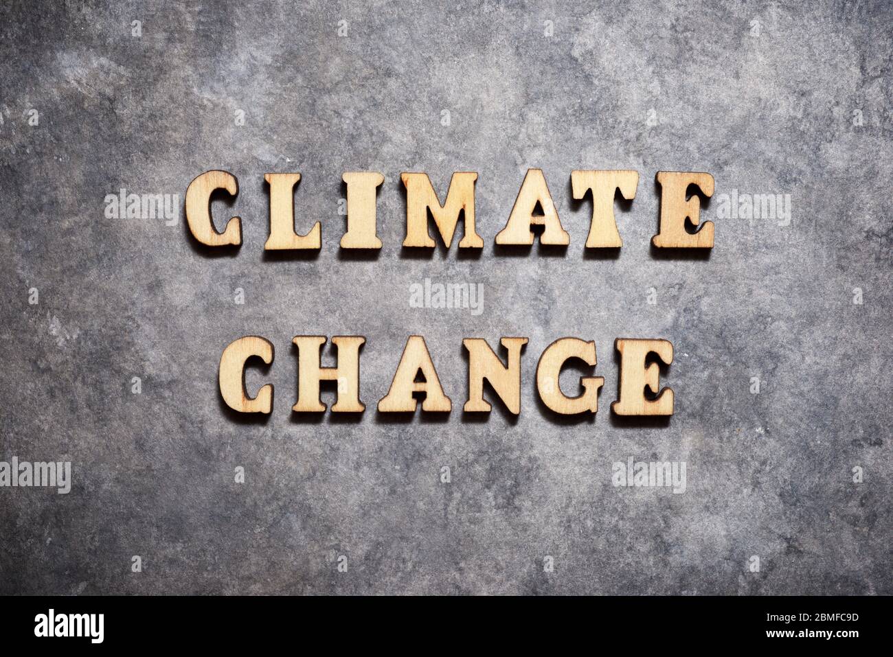 Climate change text on a gray paper Stock Photo - Alamy