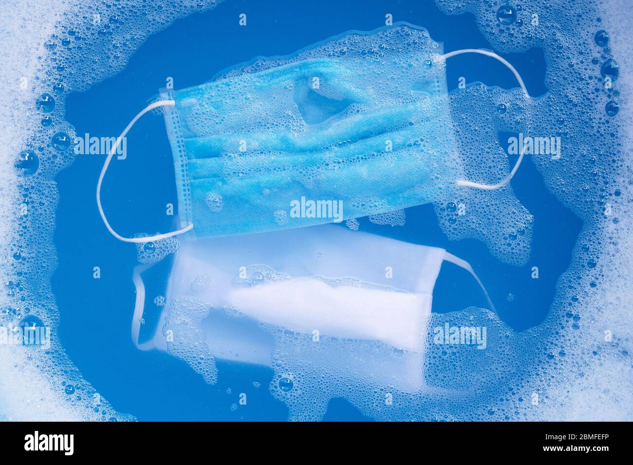 Protective medical mask with cloth mask soak in powder detergent water ...