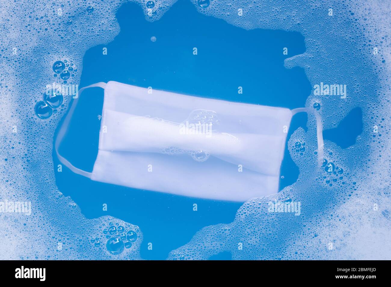 Cloth mask soak in powder detergent water dissolution before washing ...