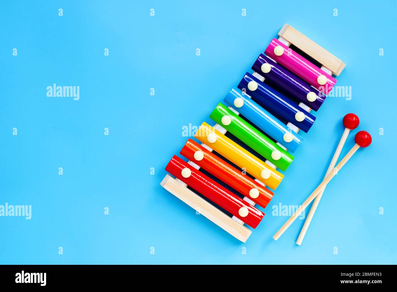 Colorful xylophone on yellow background Stock Photo - Alamy