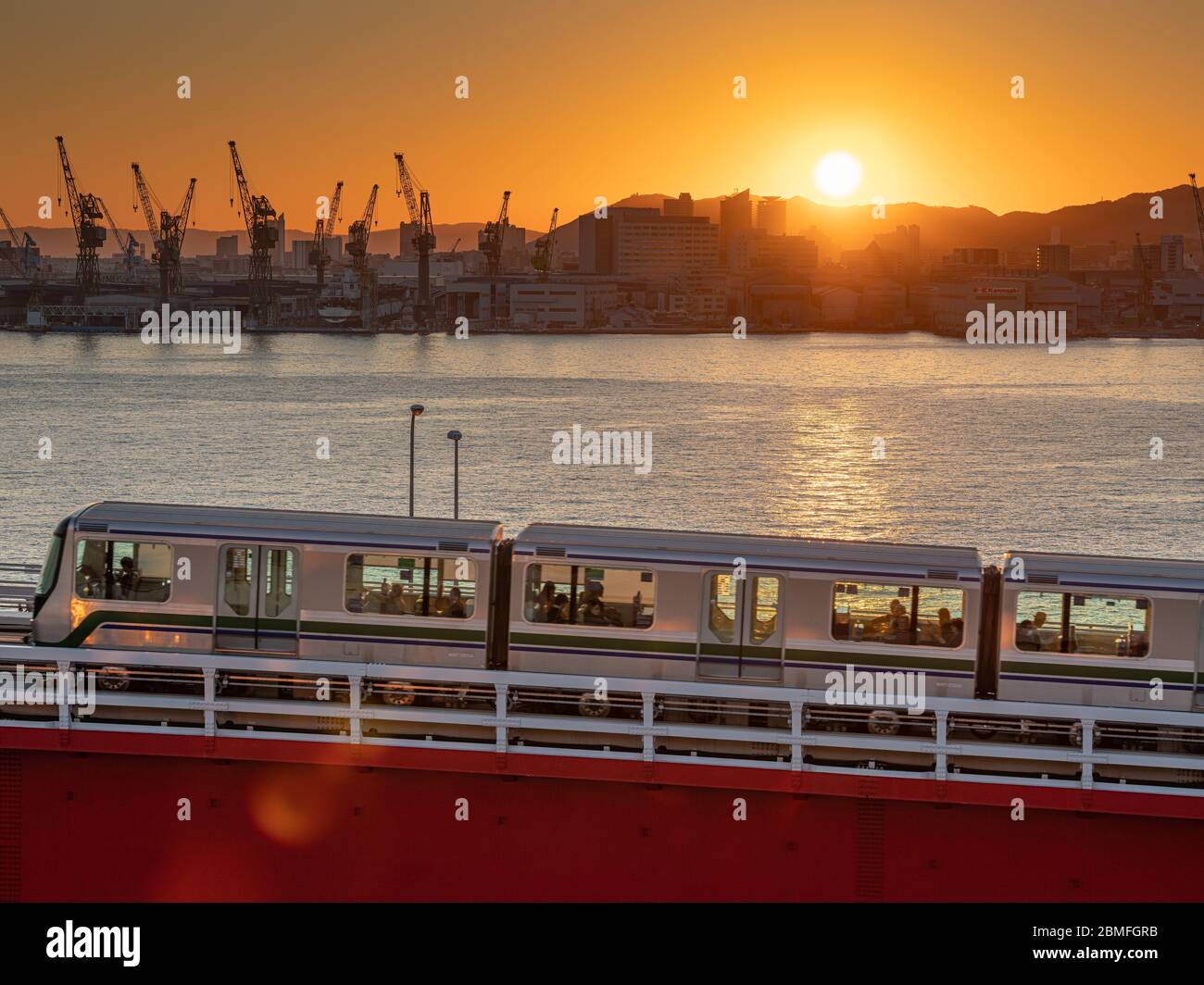 Red kobe port monorail bridge at sunset twilight in Kobe Hyogo Japan ...