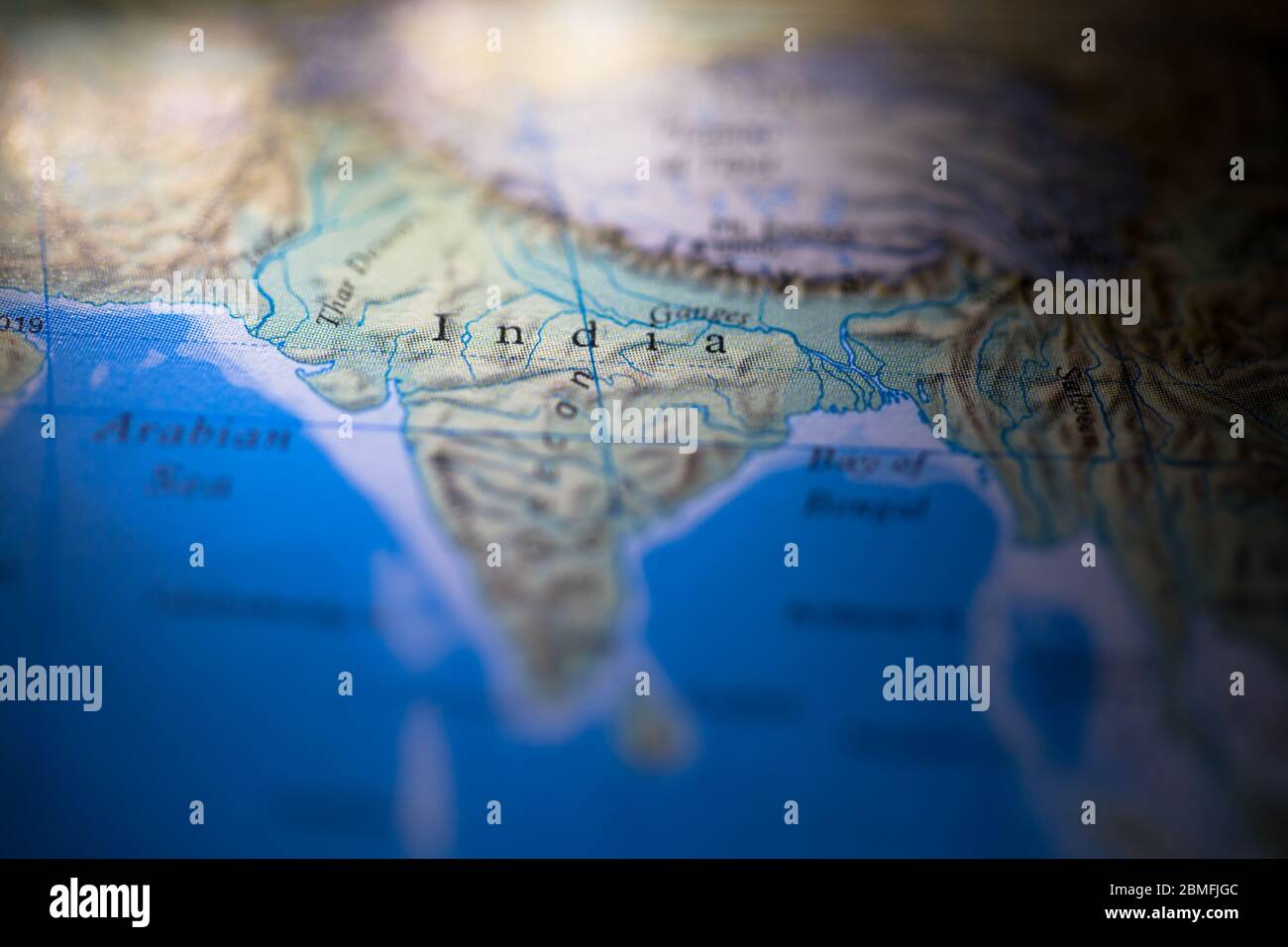 Shallow depth of field focus on geographical map location of country ...