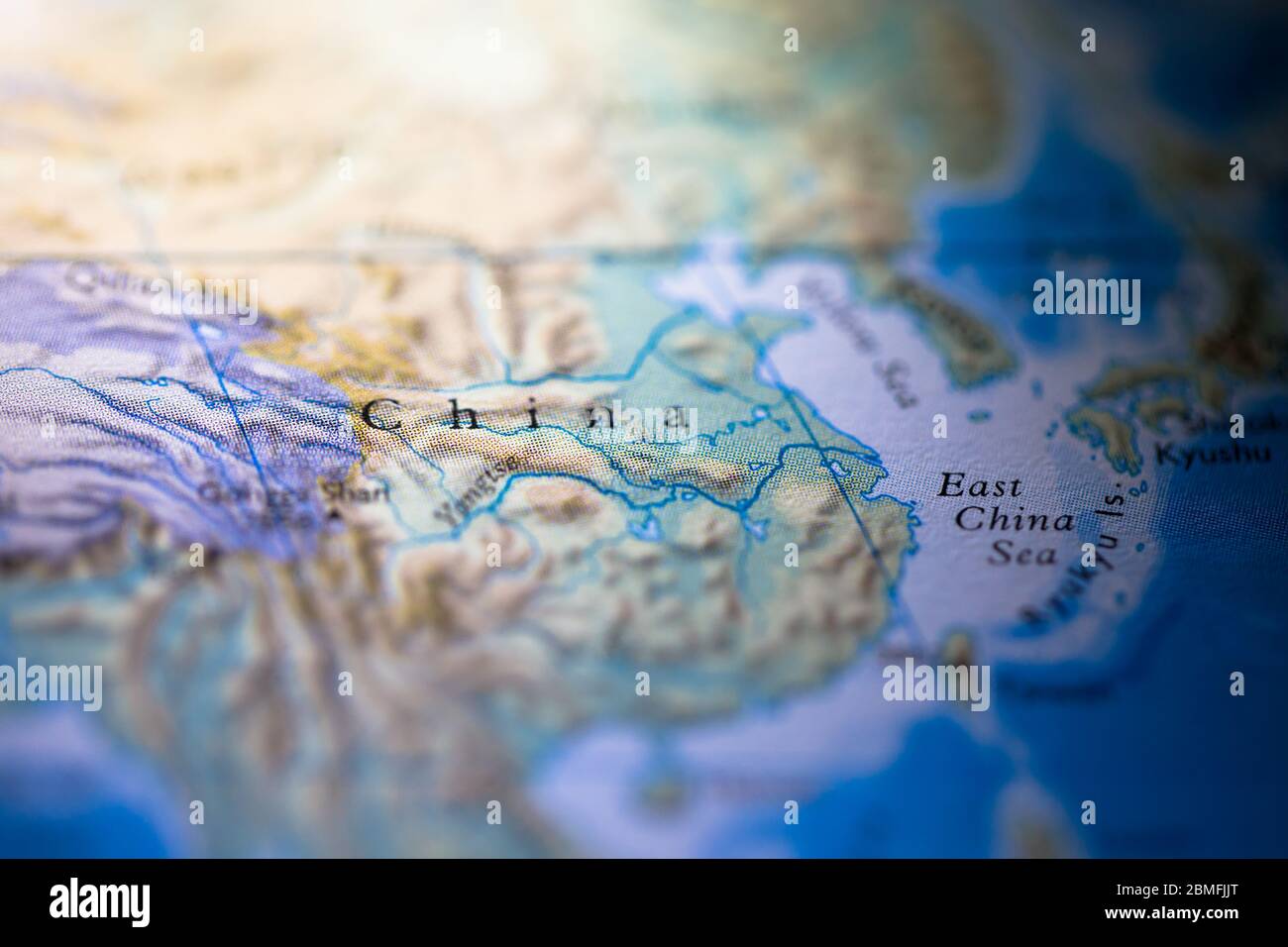 Shallow depth of field focus on geographical map location of country ...
