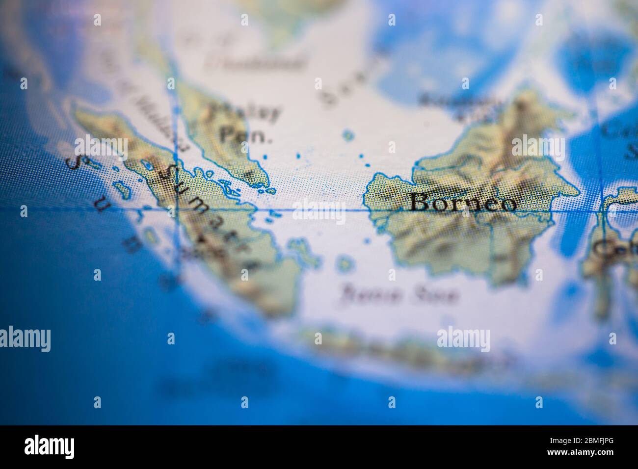 Shallow depth of field focus on geographical map location of Borneo ...