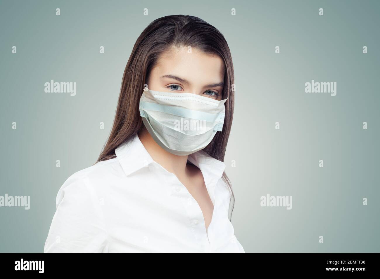 Optimistic doctor woman in protective mask on white background Stock ...