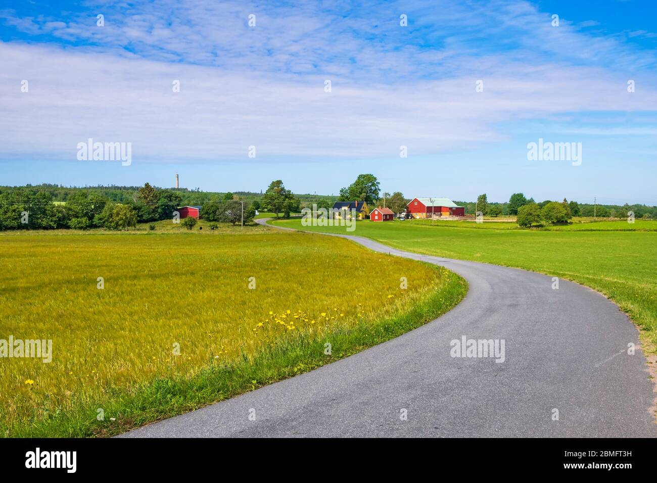 Curve on a country road in a rural landscape Stock Photo - Alamy