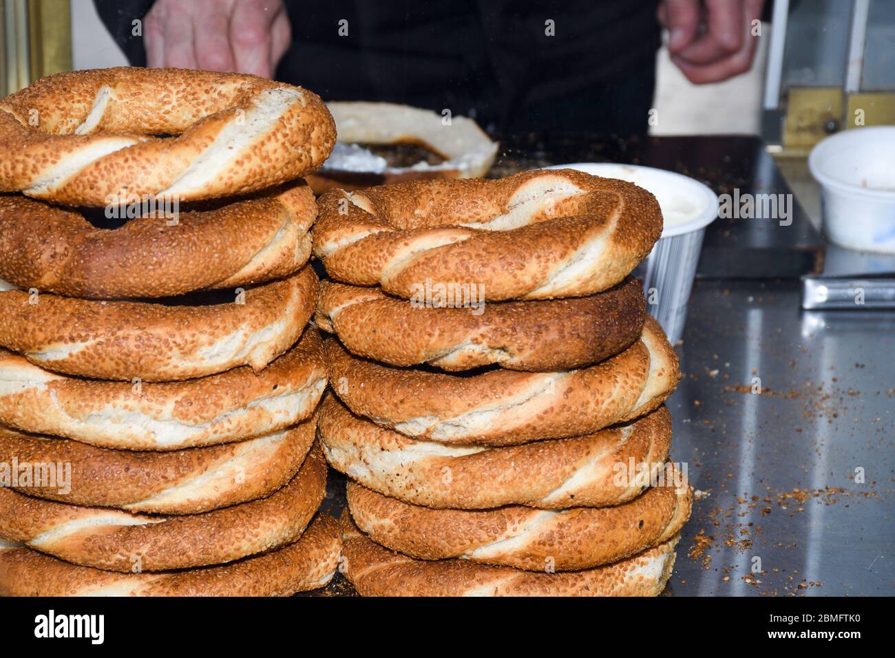 Simit is a Turkish loop-shaped bread, encrusted with sesame seeds, and ...