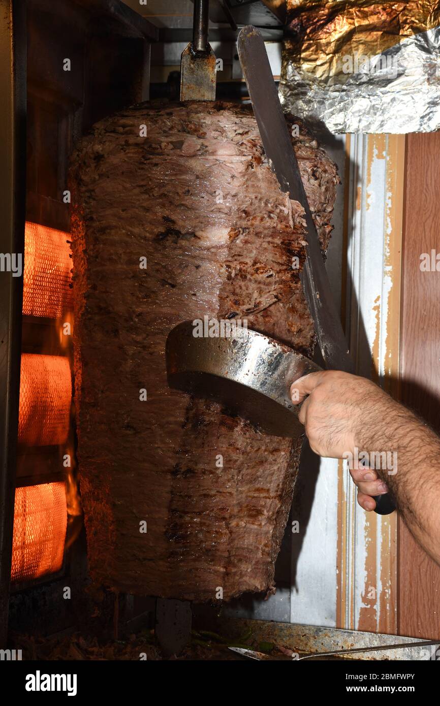 Shawarma, a dish in Middle Eastern cuisine consisting of meat cut into ...