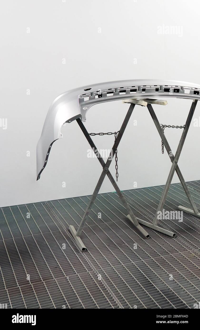 Car bumper after painting. Drying parts of the automobile in spray ...