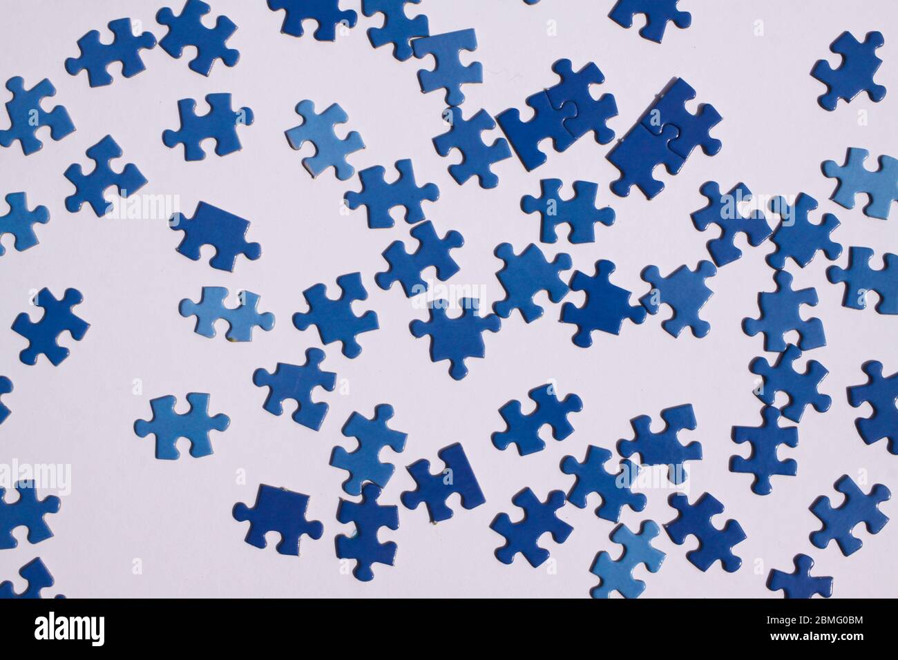 Close up of isolated blue puzzle pieces, white background Stock Photo ...
