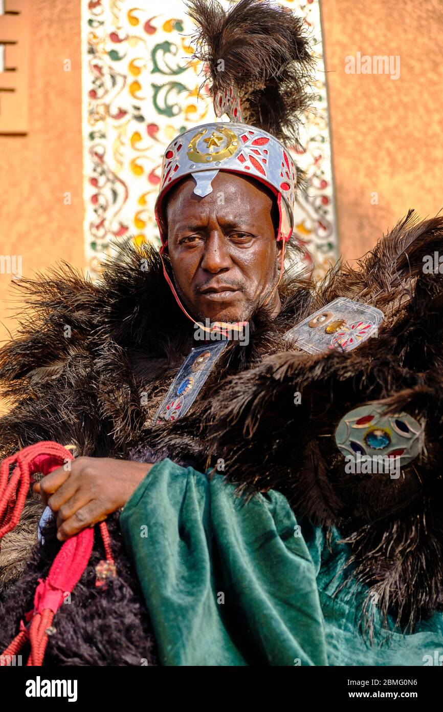 Nobleman rider dressed in a colourful outfit mounting an embellished ...