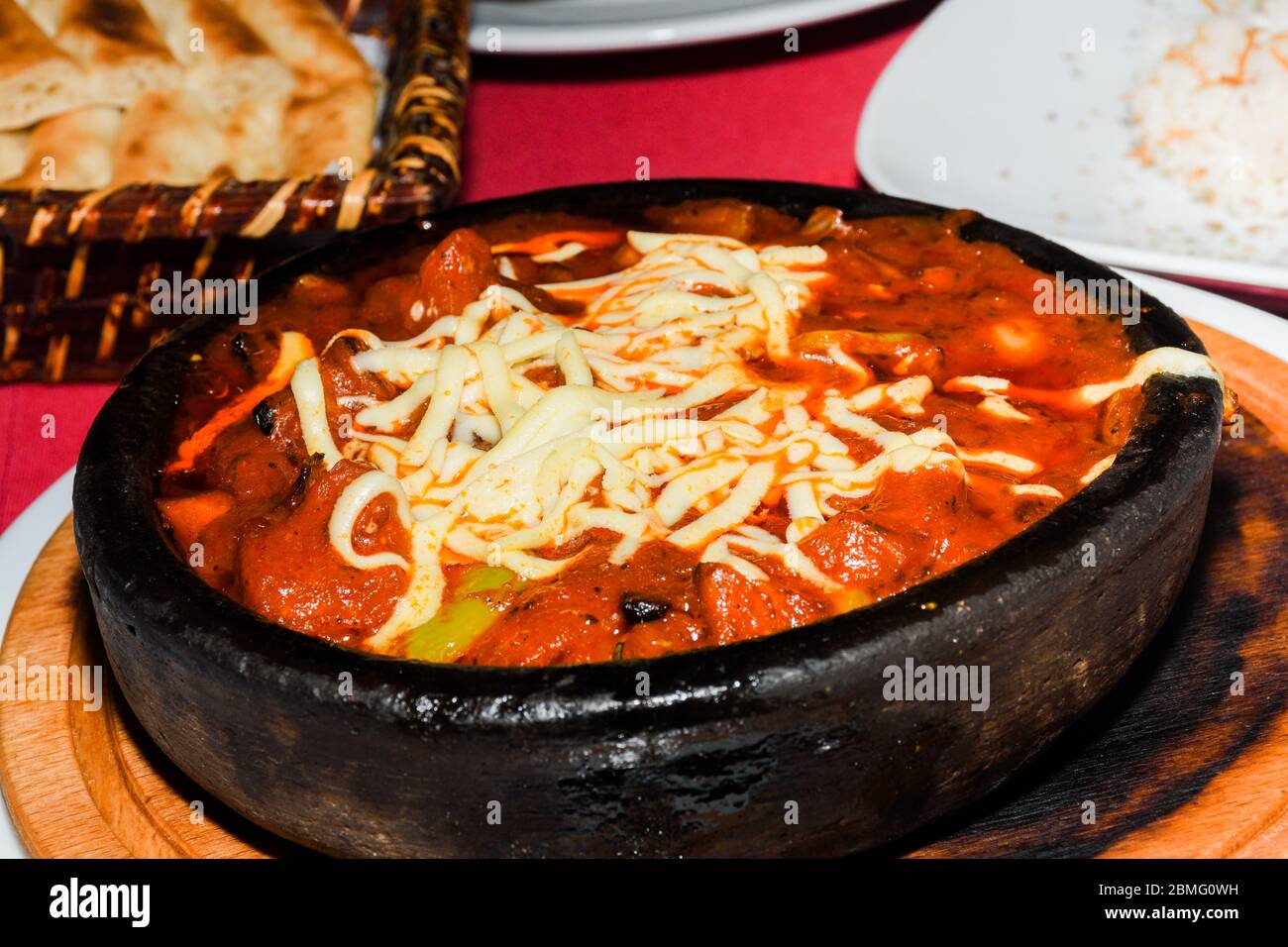 Indian cuisine: traditional chicken curry with potatoes, garlic, ginger ...