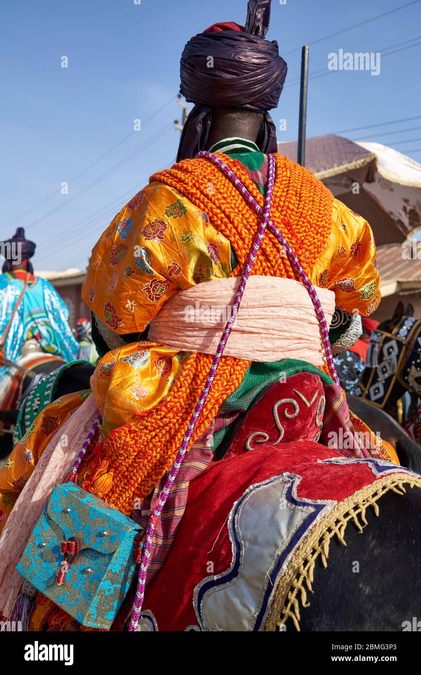 Nobleman rider dressed in a colourful outfit mounting an embellished ...