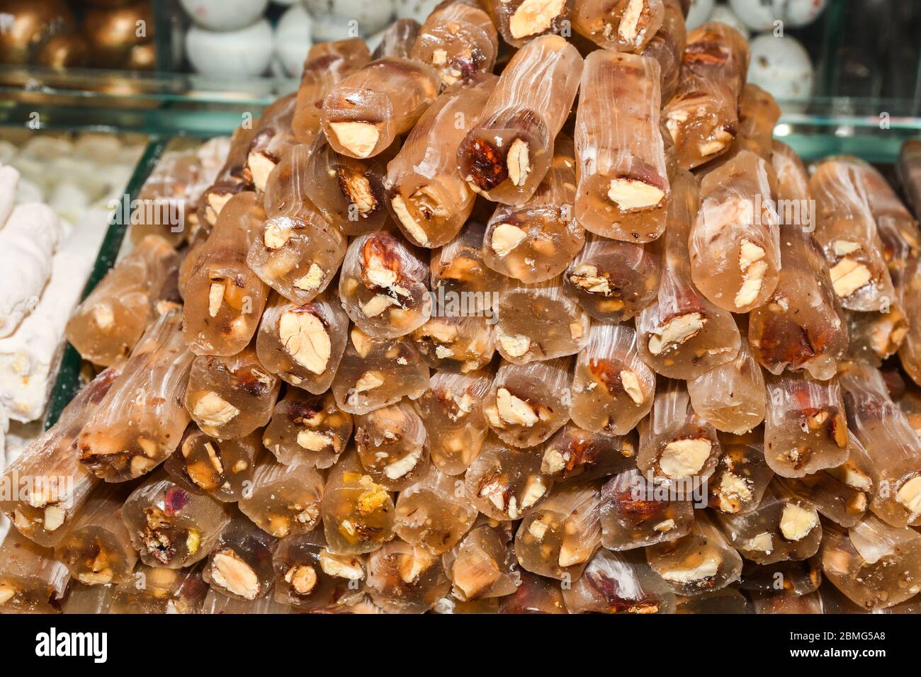 Cevizli sucuk made by dipping a string with walnuts into a grape ...