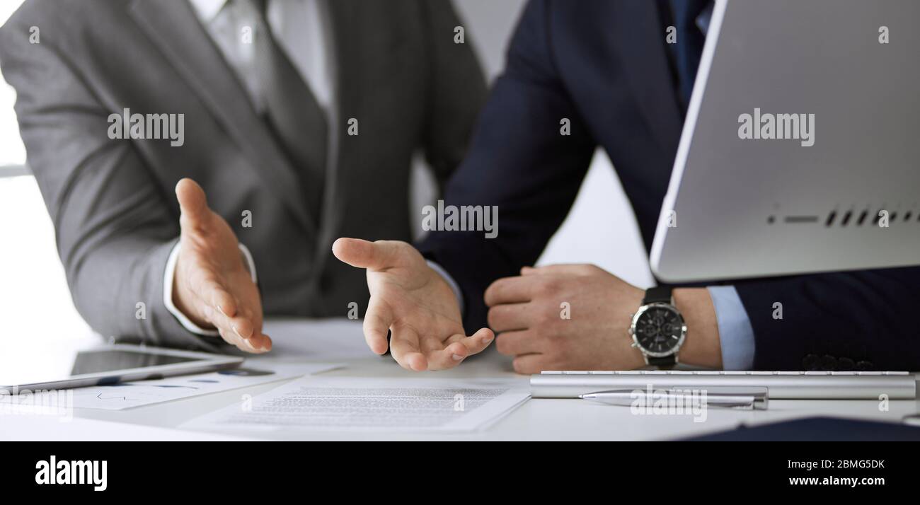 Business people using computer while working together in modern office ...