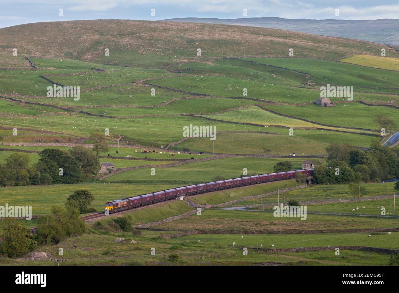 DB cargo EWS Livery class 66 locomotive hauling a train of empty HTA ...