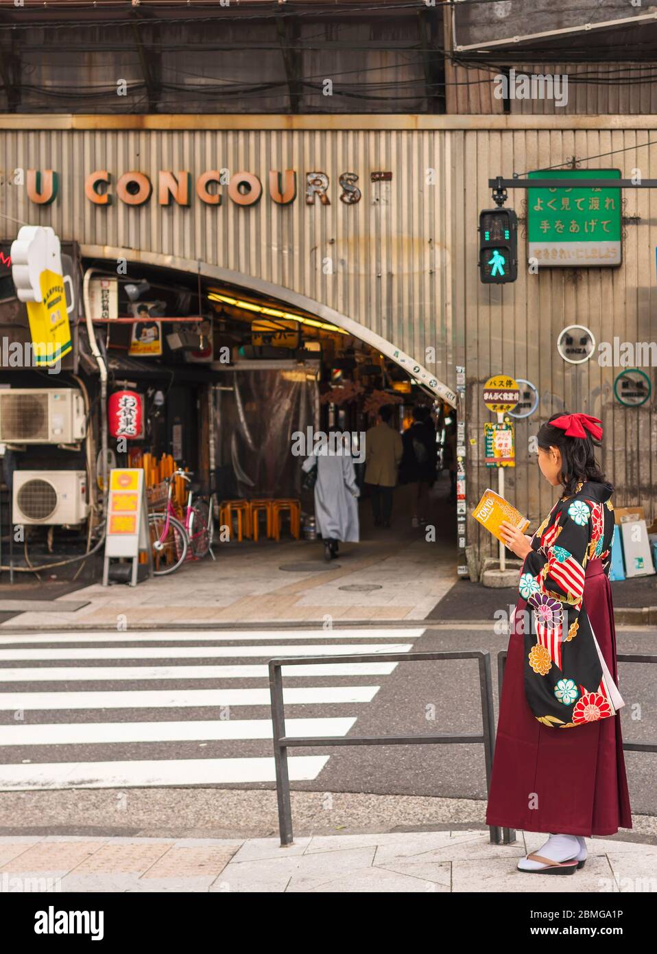 tokyo, japan - march 25 2020: Japanese woman in hakama kimono reading a ...