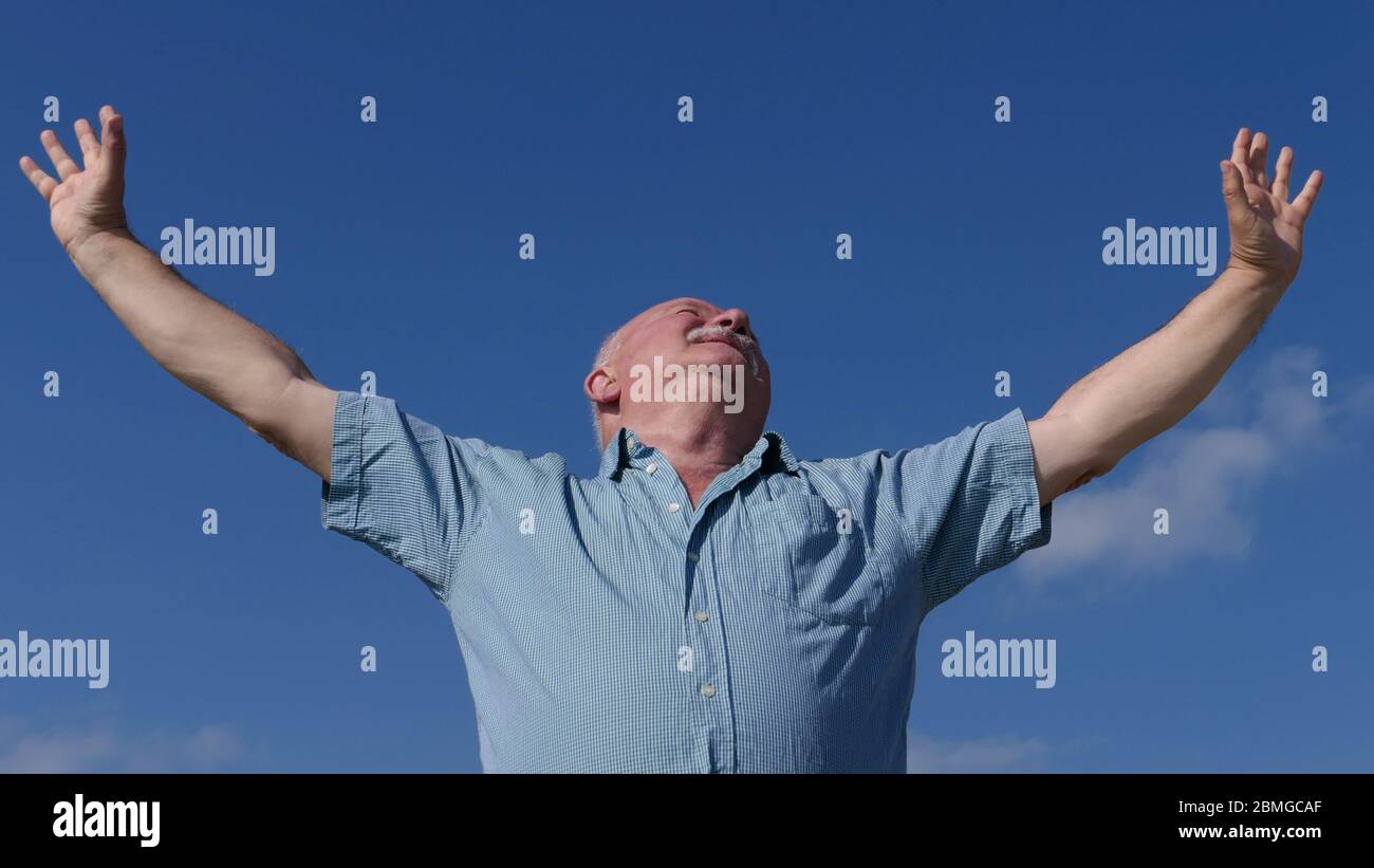 Happy old man with his arms raised Stock Photo - Alamy