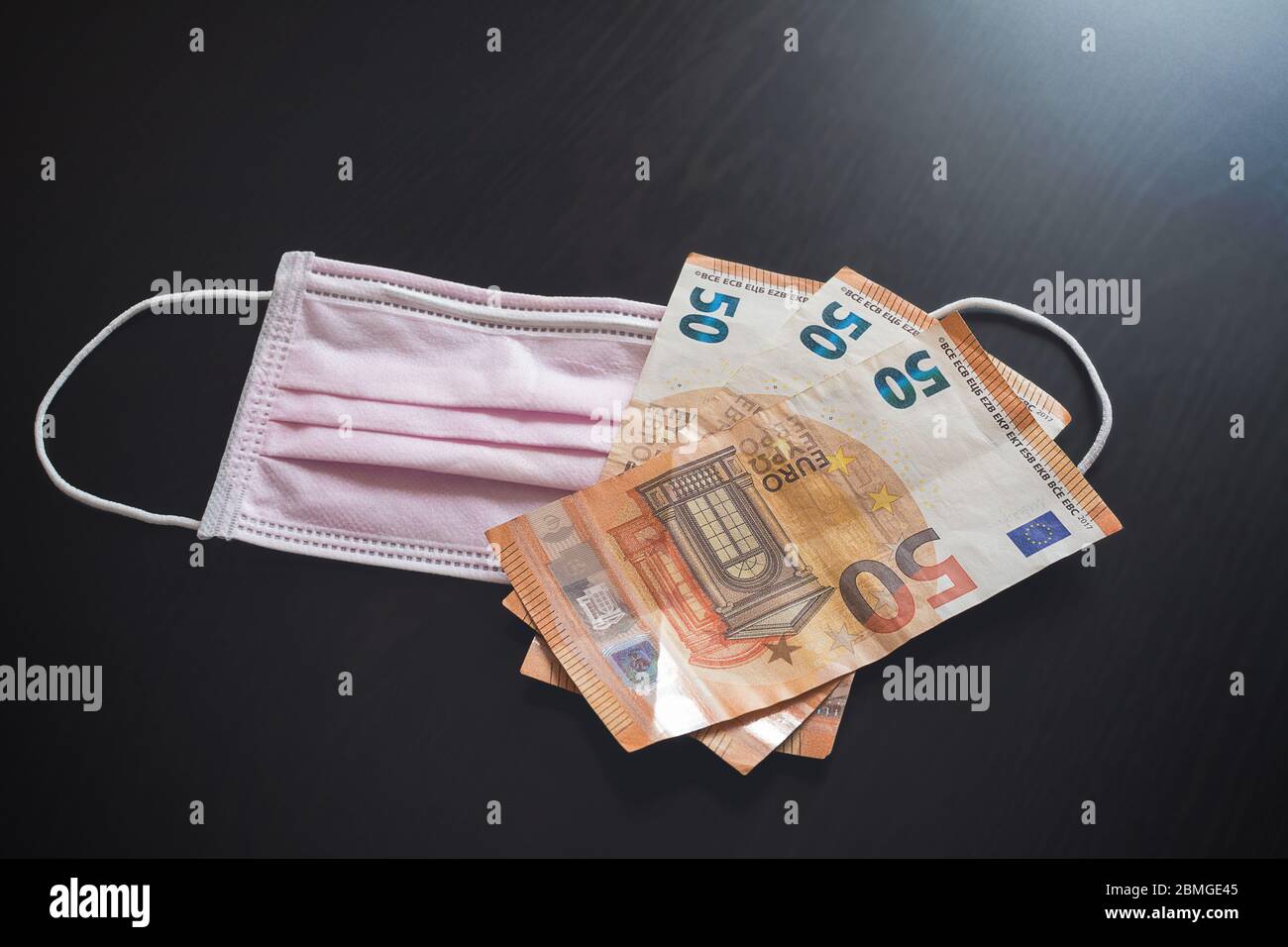 Medical face masks and money. Surgical face mask. COVID-19 Has Caused A ...