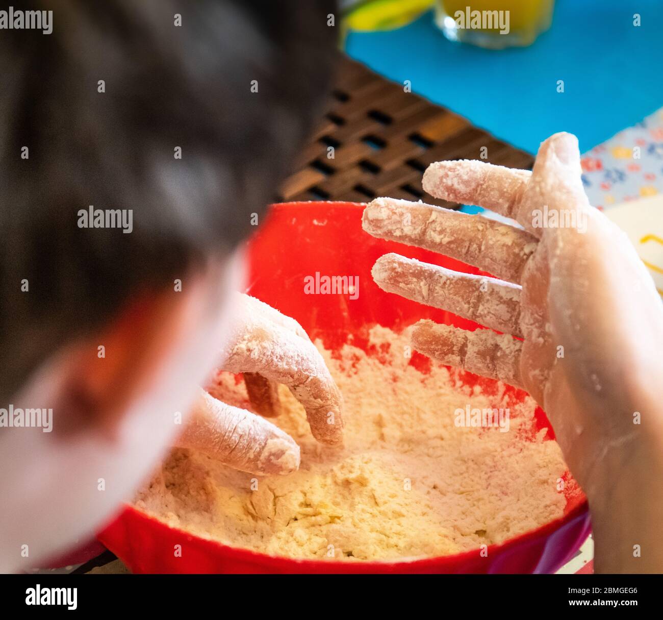 messy hands whilst mixing cake ingredients at home and baking Stock ...