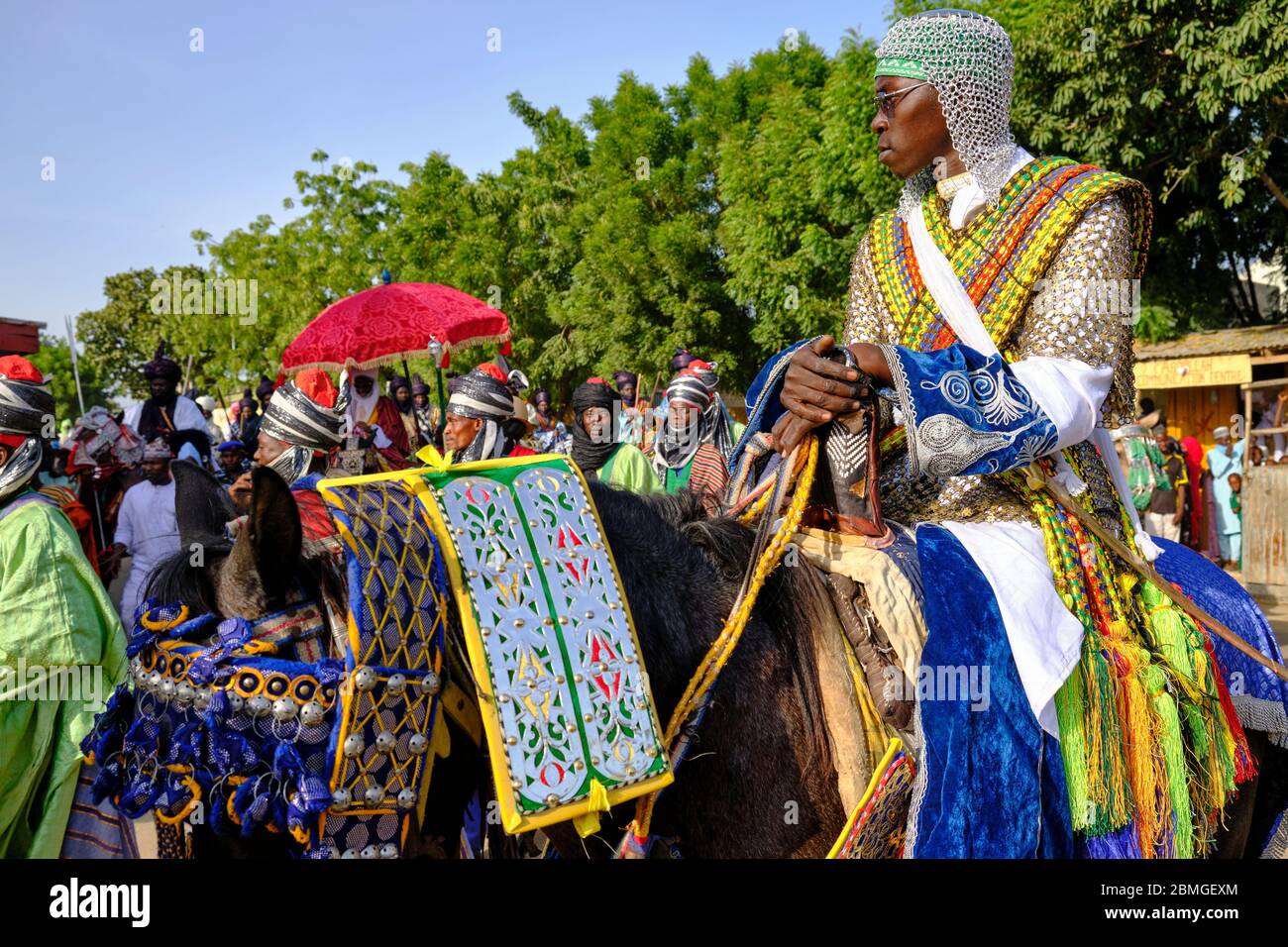 Nobleman rider dressed in a colourful outfit mounting an embellished ...