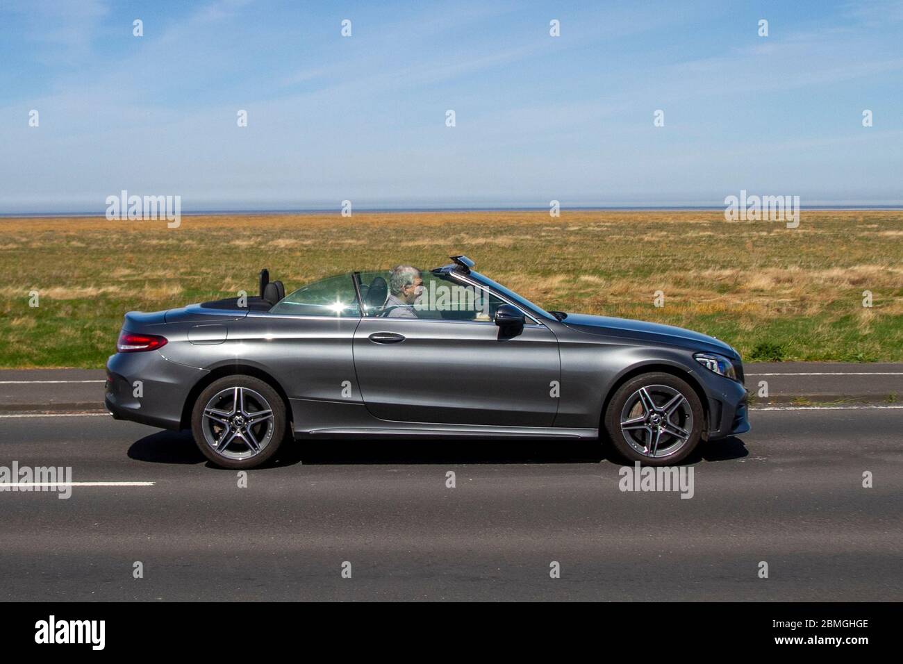 2018 silver grey Mercedes Benz convertible; UK Vehicular traffic, road ...
