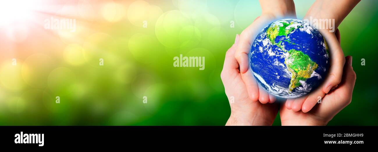 Caring Hands Of Man And Woman Holding Earth - Earth Day / Care For The ...