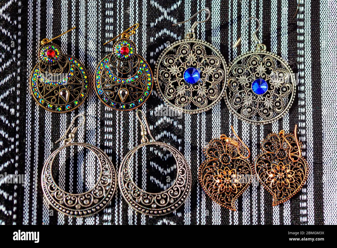 collection of earrings made by silver and gold Stock Photo - Alamy