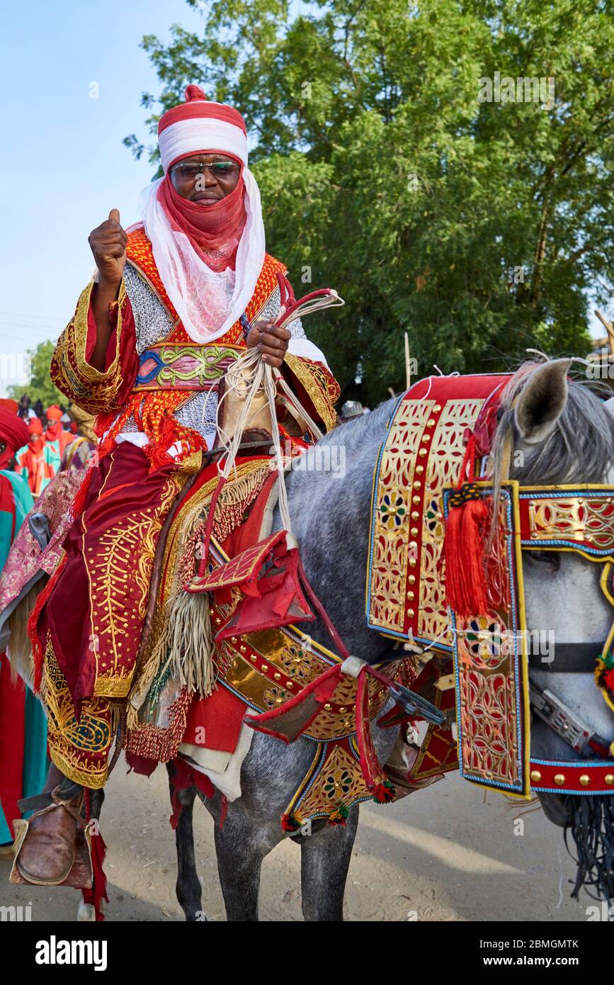Nobleman rider dressed in a colourful outfit mounting an embellished ...