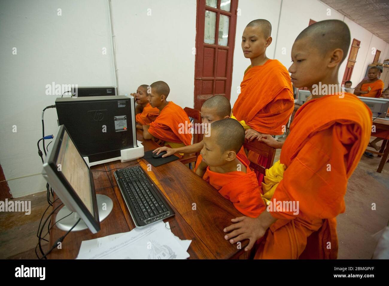 YOUNG BUDDHISTS MONKS USING COMPUTERS IN LUANG PRABANG, LAOS Stock ...