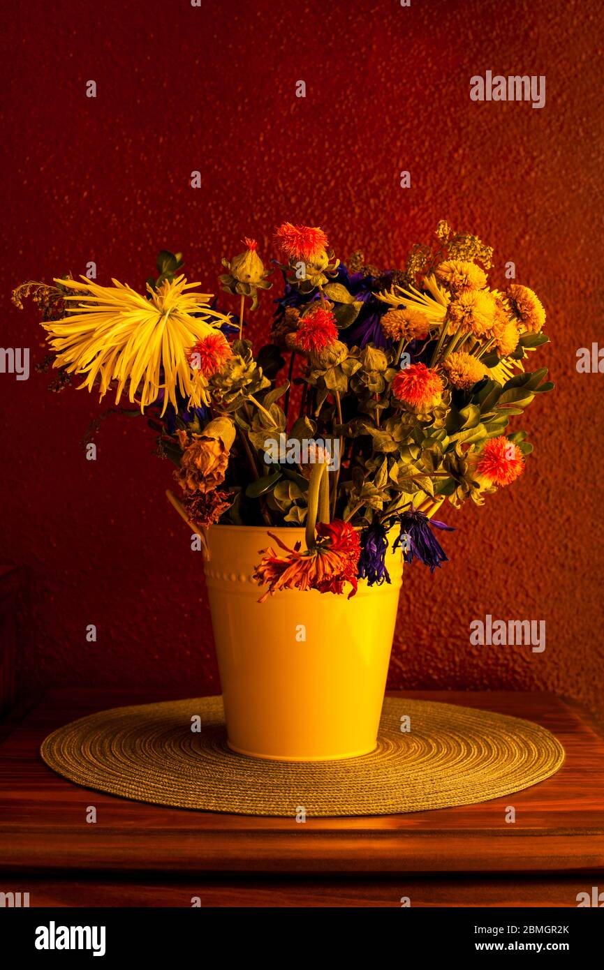 Wilting flowers including mums,chrysanthemums,carnations in yellow ...