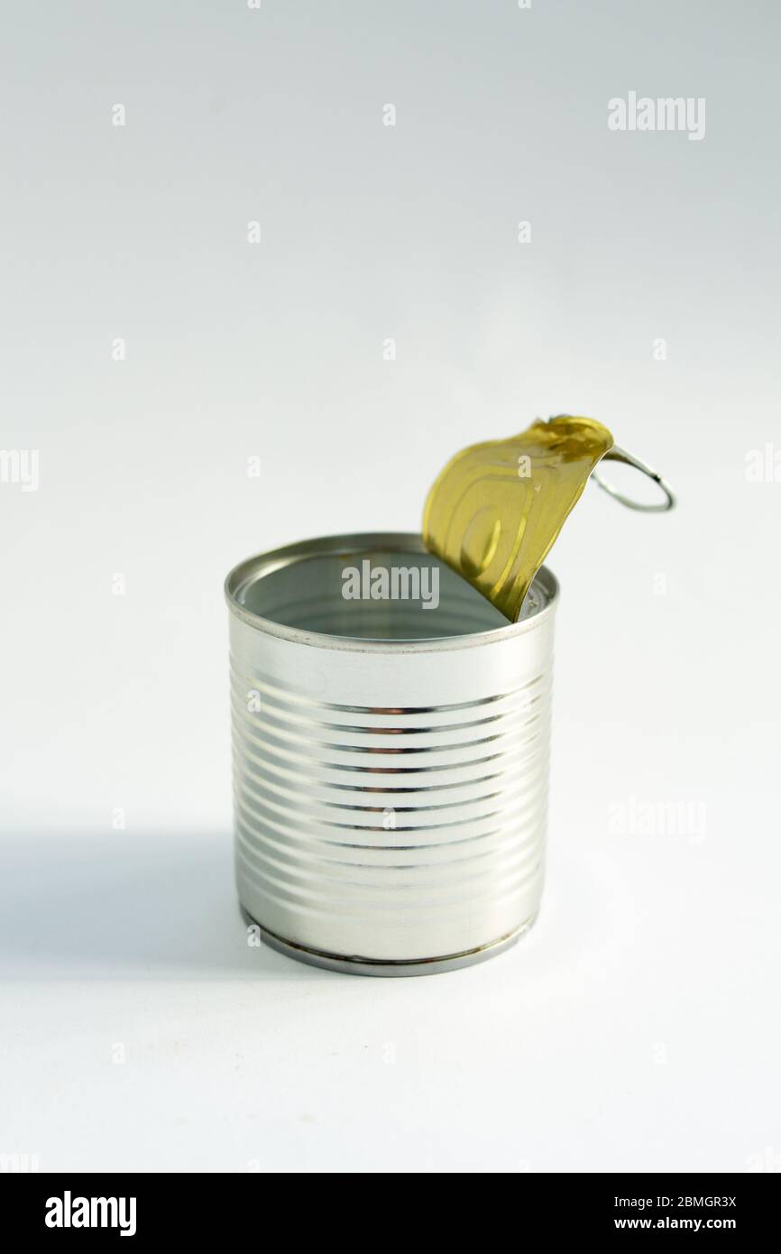 open tin can on a white background Stock Photo - Alamy