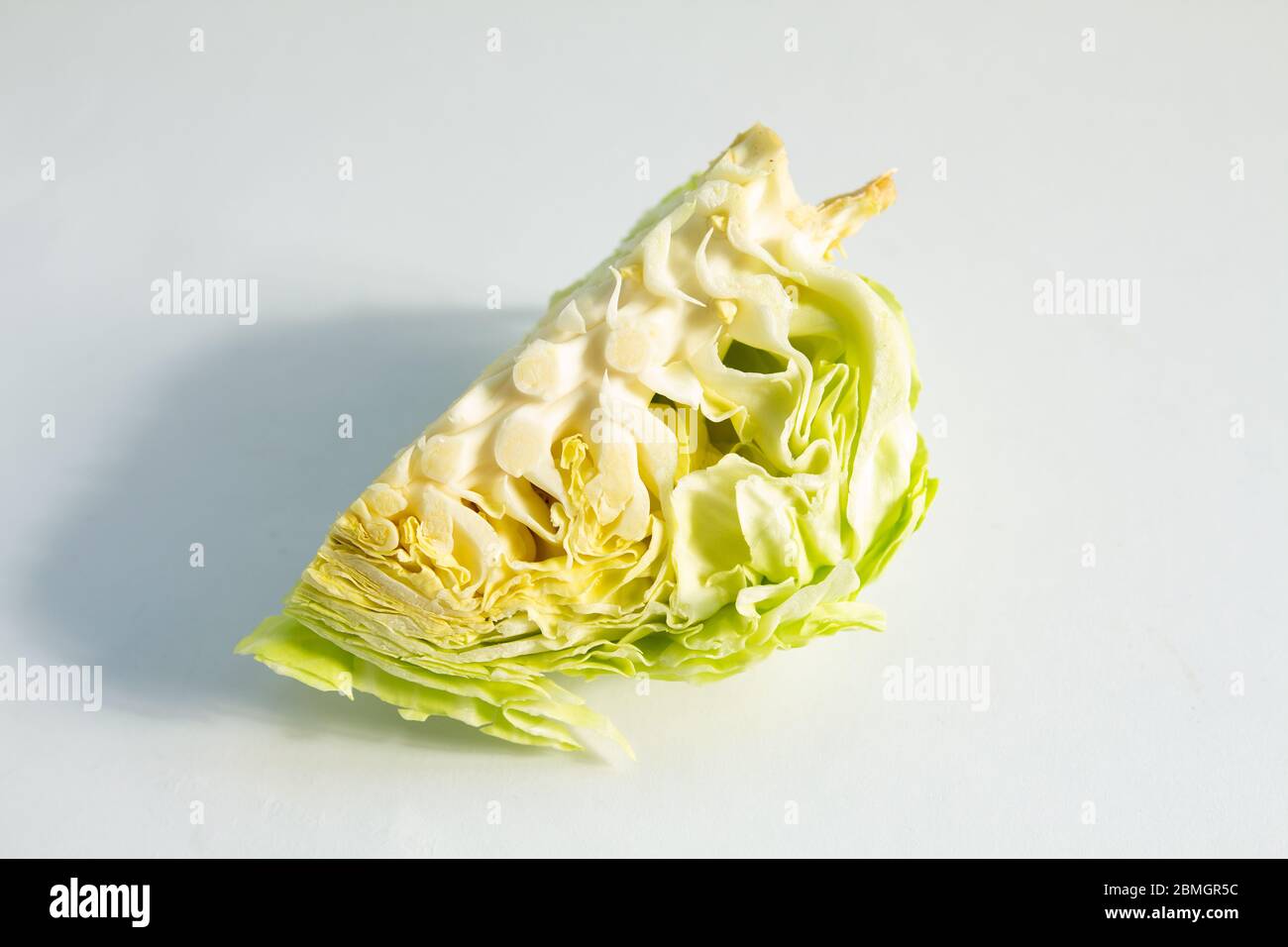 chopped piece of cabbage on white background Stock Photo - Alamy