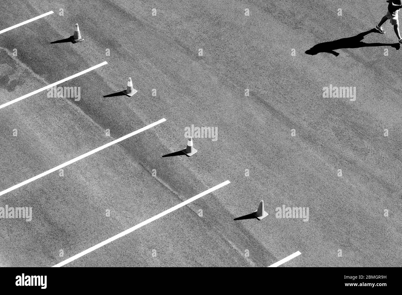 Overhead view of traffic cones and person walking by Stock Photo - Alamy