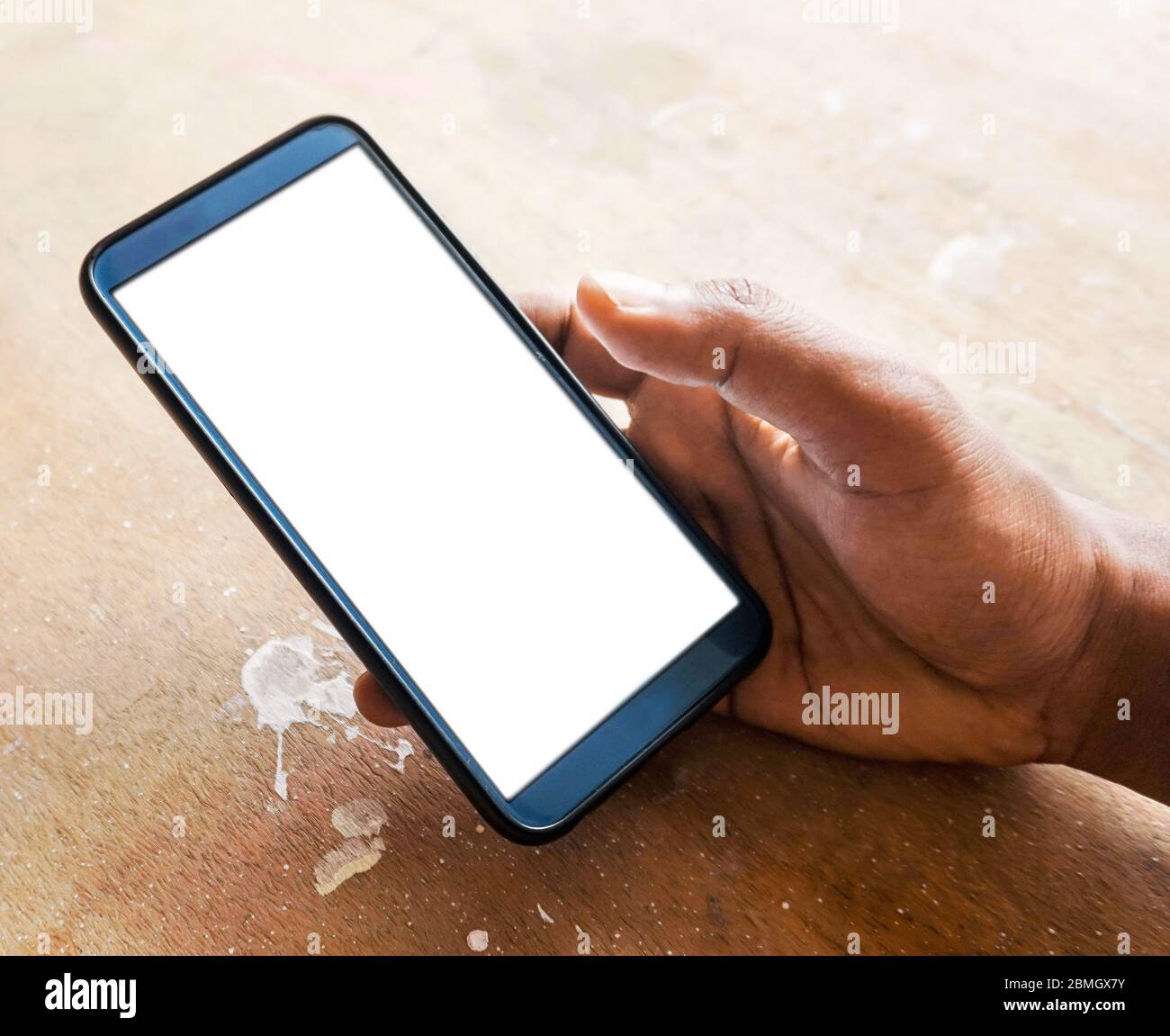 hand holding smart phone with white screen Stock Photo - Alamy