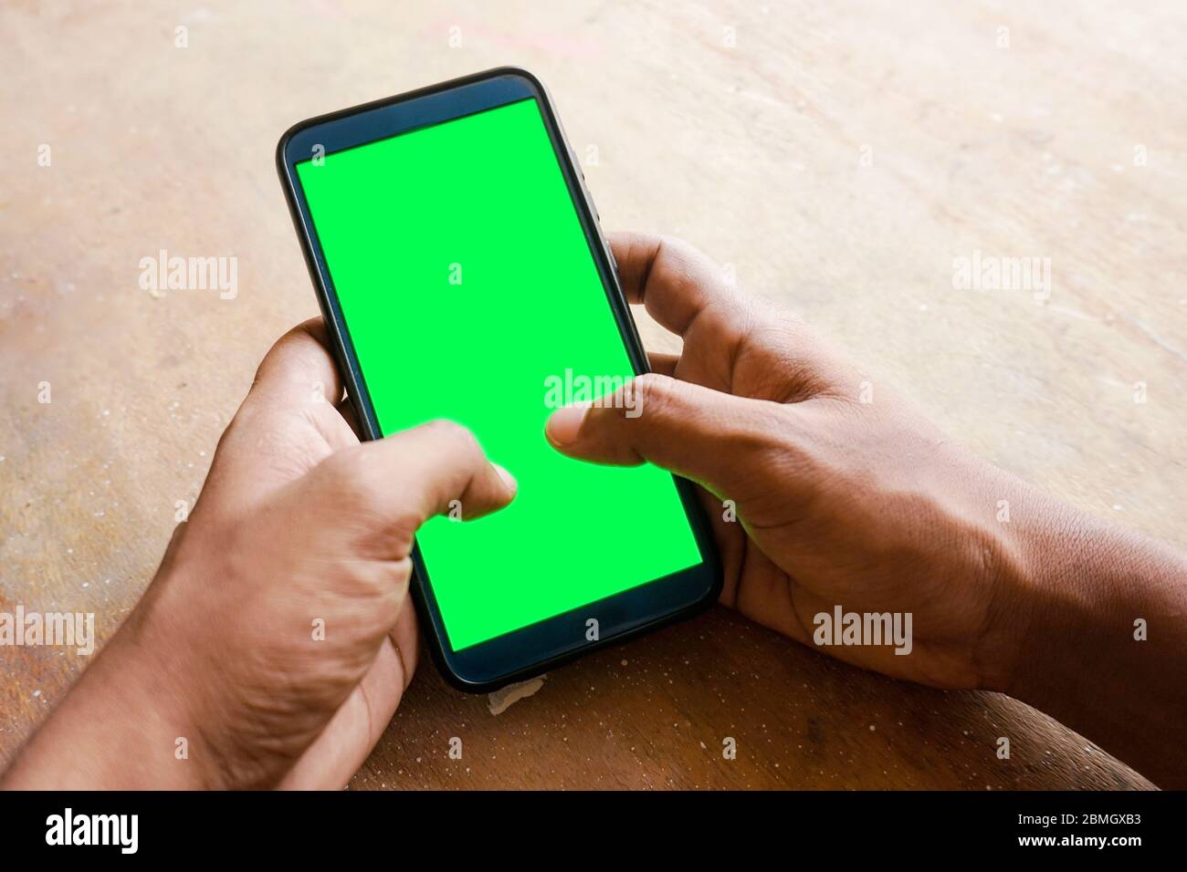 hand holding smart phone with green screen Stock Photo - Alamy