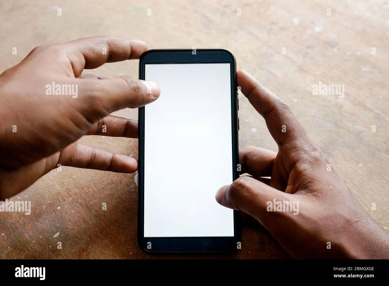 hand holding smart phone with white screen Stock Photo - Alamy